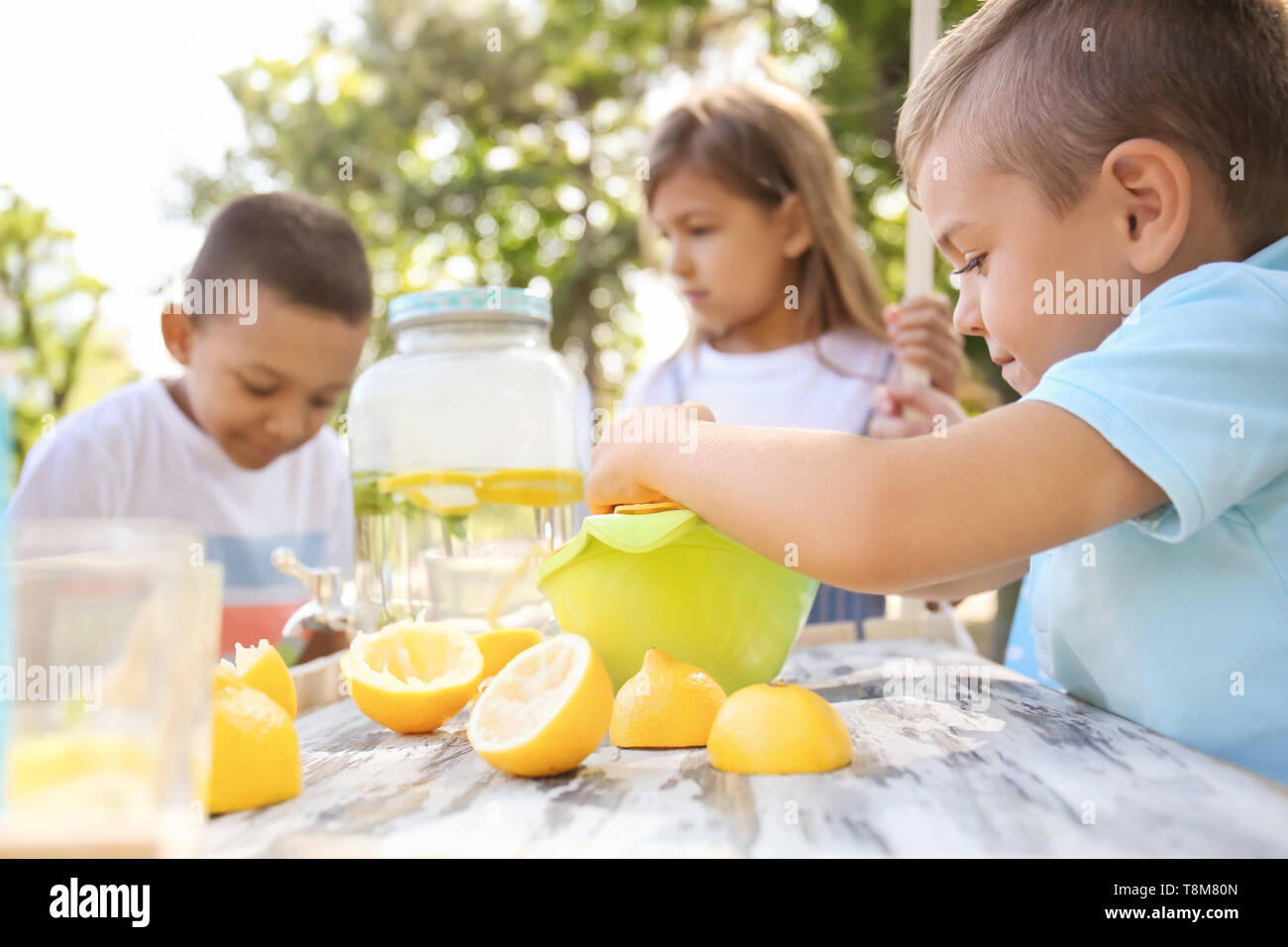 Lemon squeezing child hi-res stock photography and images - Alamy