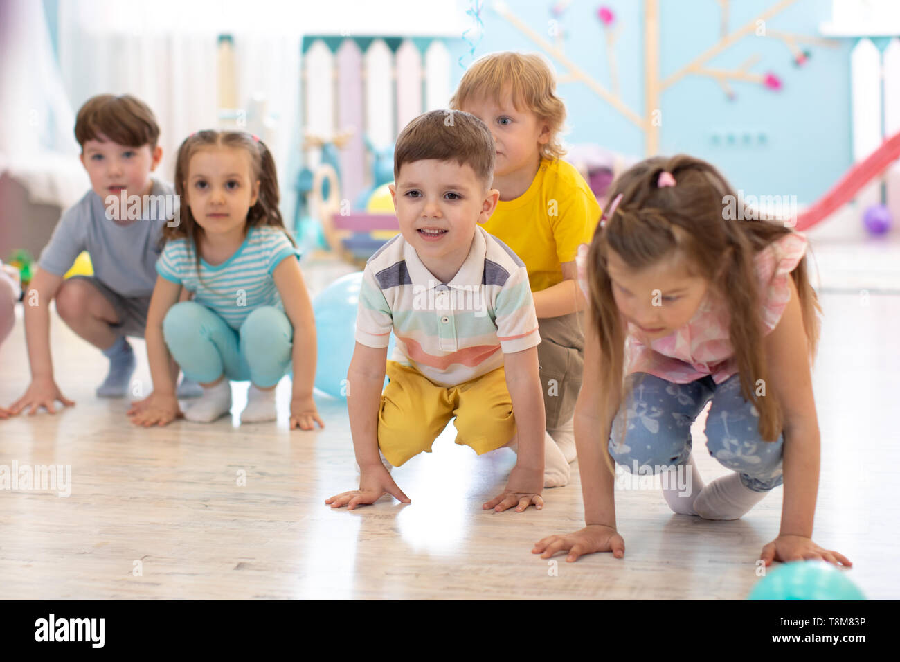 Crouching children prepared to jump. Sport activities Stock Photo - Alamy