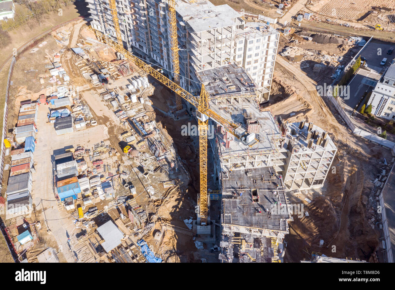 aerial top view of city construction site with tower cranes and other ...