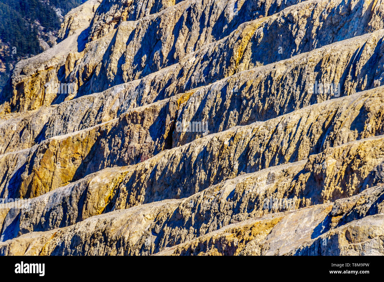 The terraced mountain side of a limestone Quarry in Marble Canyon ...