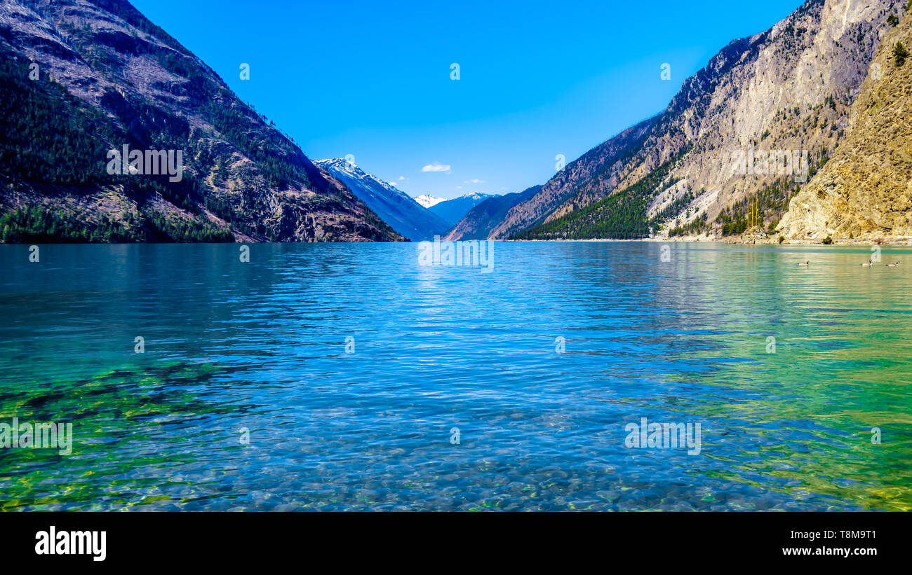 Green waters of Seton Lake on the foot of Mount McLean near Lillooet ...