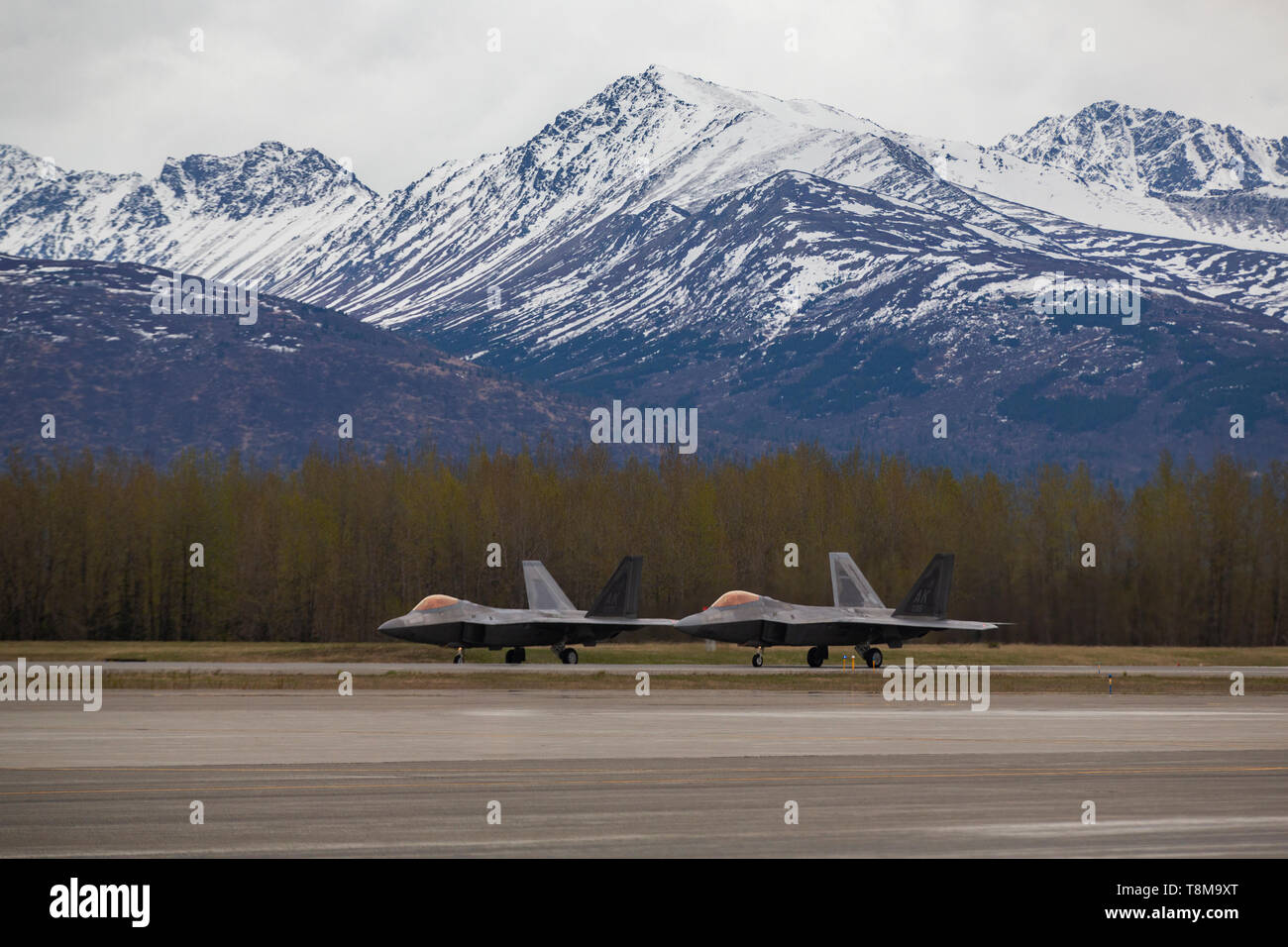 U.S. Air Force F-22 Raptors line up on the runway for takeoff, May 9 ...