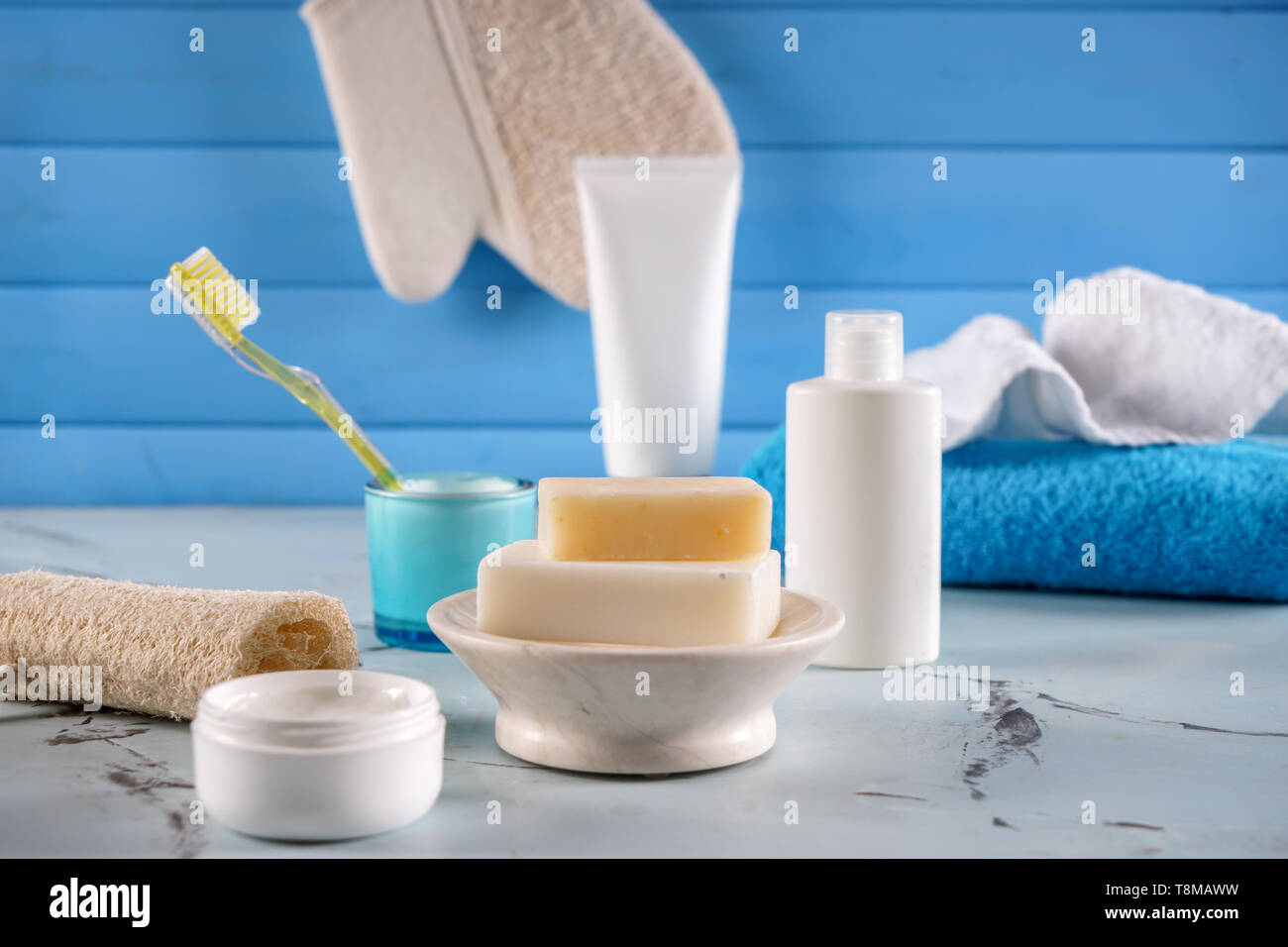 Set of bath cosmetics and accessories on color table Stock Photo - Alamy
