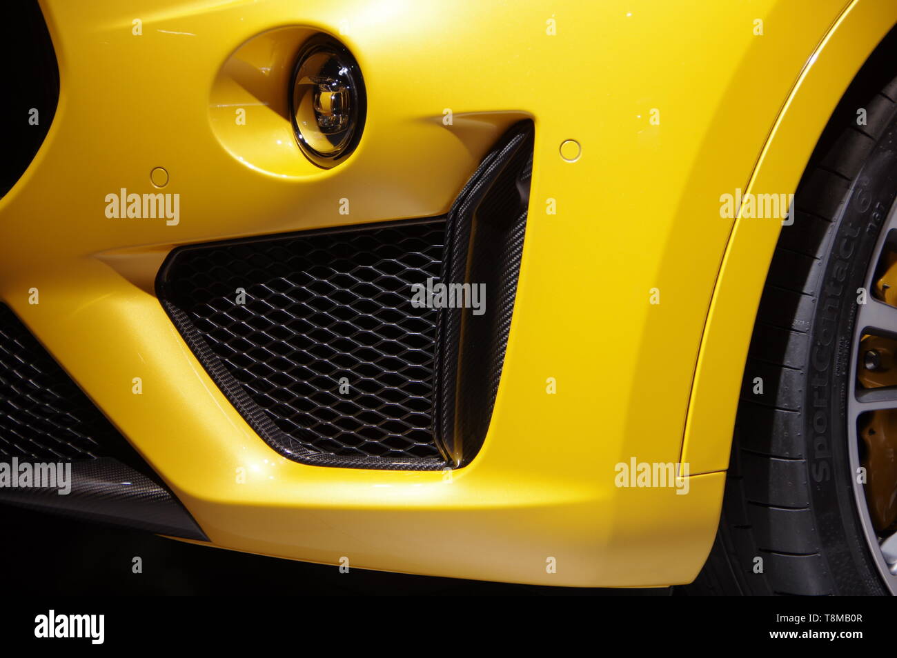 Yellow car body carbon fiber detail Stock Photo - Alamy