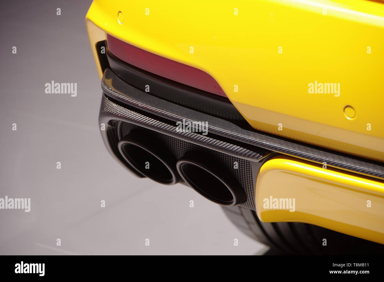 Yellow car body carbon fiber detail Stock Photo - Alamy
