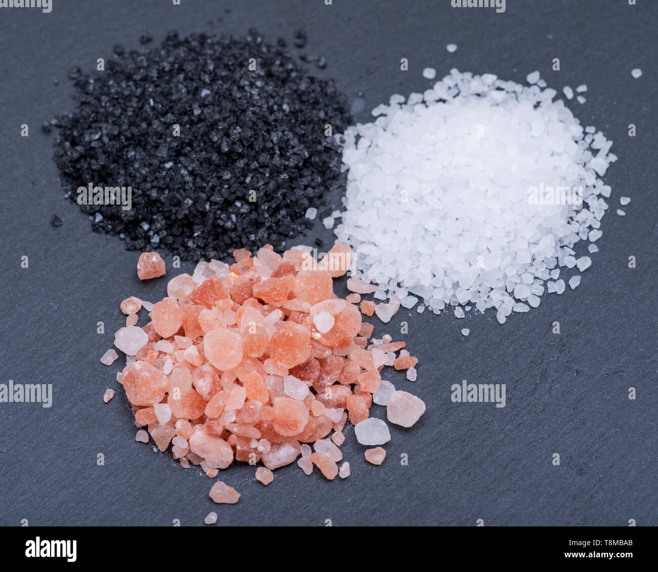 Piles of Hawaiian Black Lava Sea Salt, Coarse White Sea Salt and ...