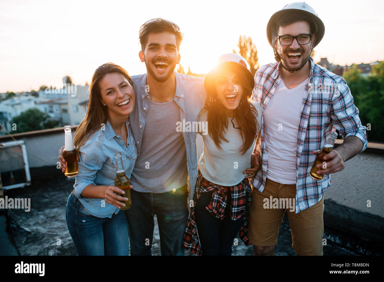Happy cheerful friends spending fun times together Stock Photo - Alamy