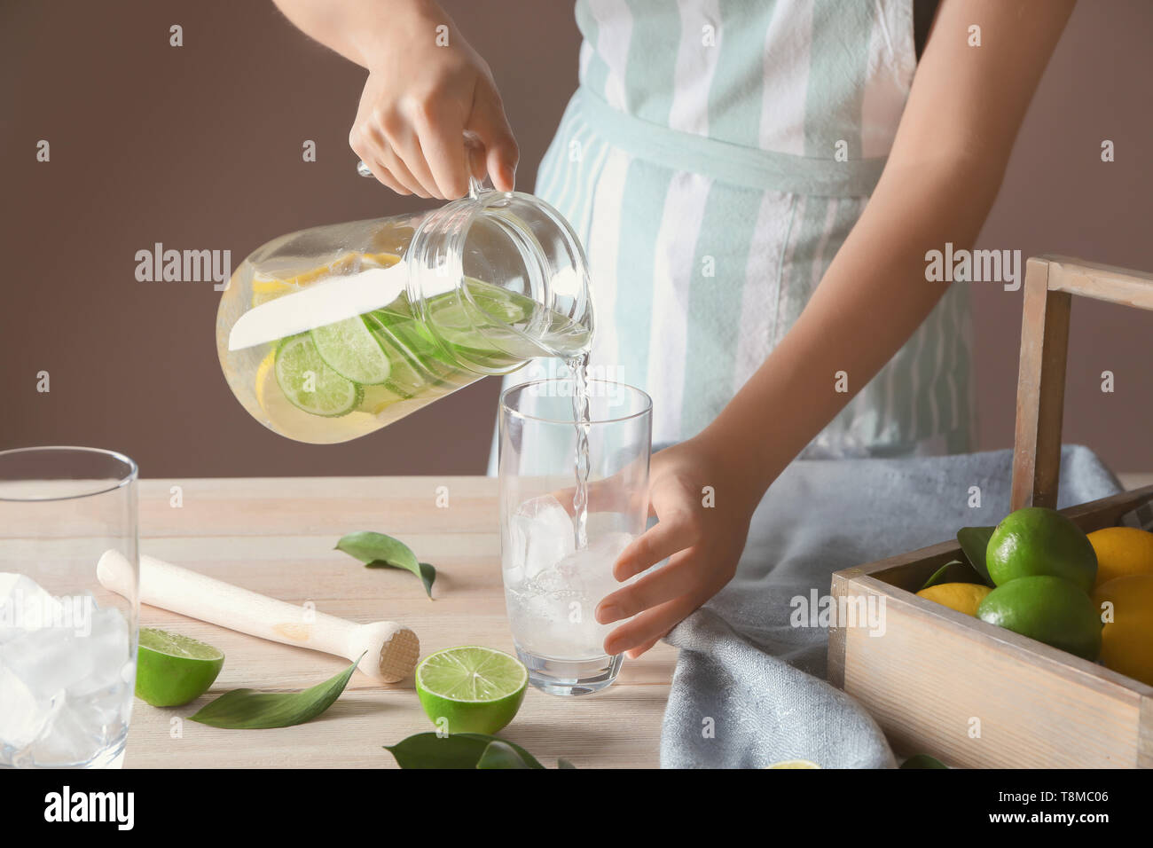 Woman pouring tasty lemonade hi-res stock photography and images - Alamy