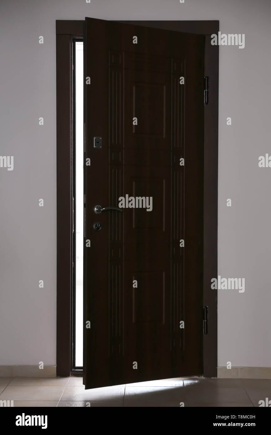 View of ajar wooden door Stock Photo - Alamy