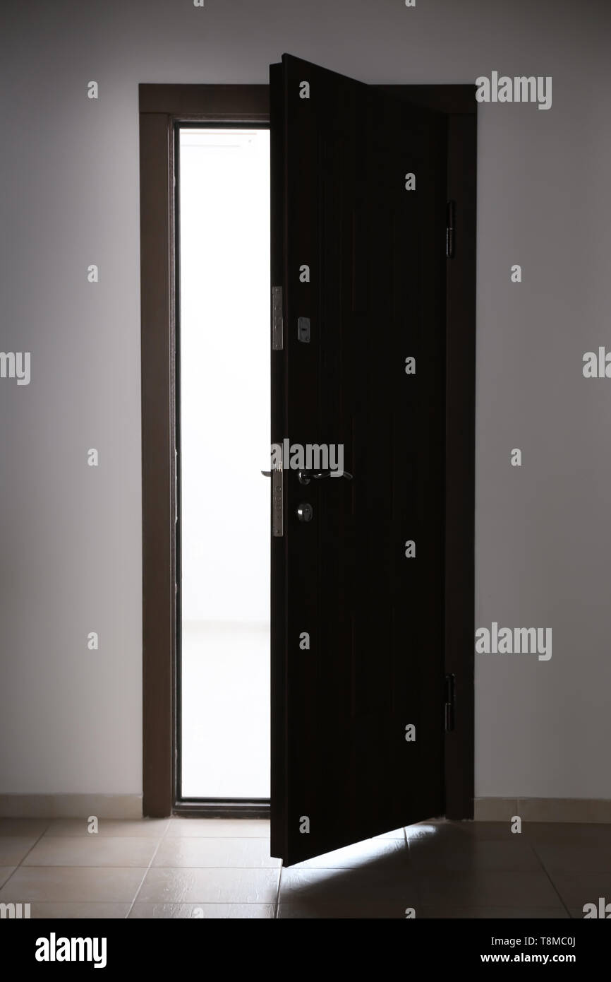 View of ajar wooden door Stock Photo - Alamy
