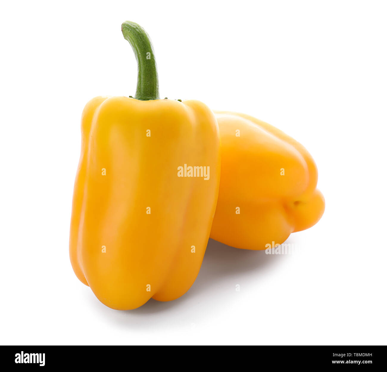 Fresh yellow peppers on white background Stock Photo - Alamy