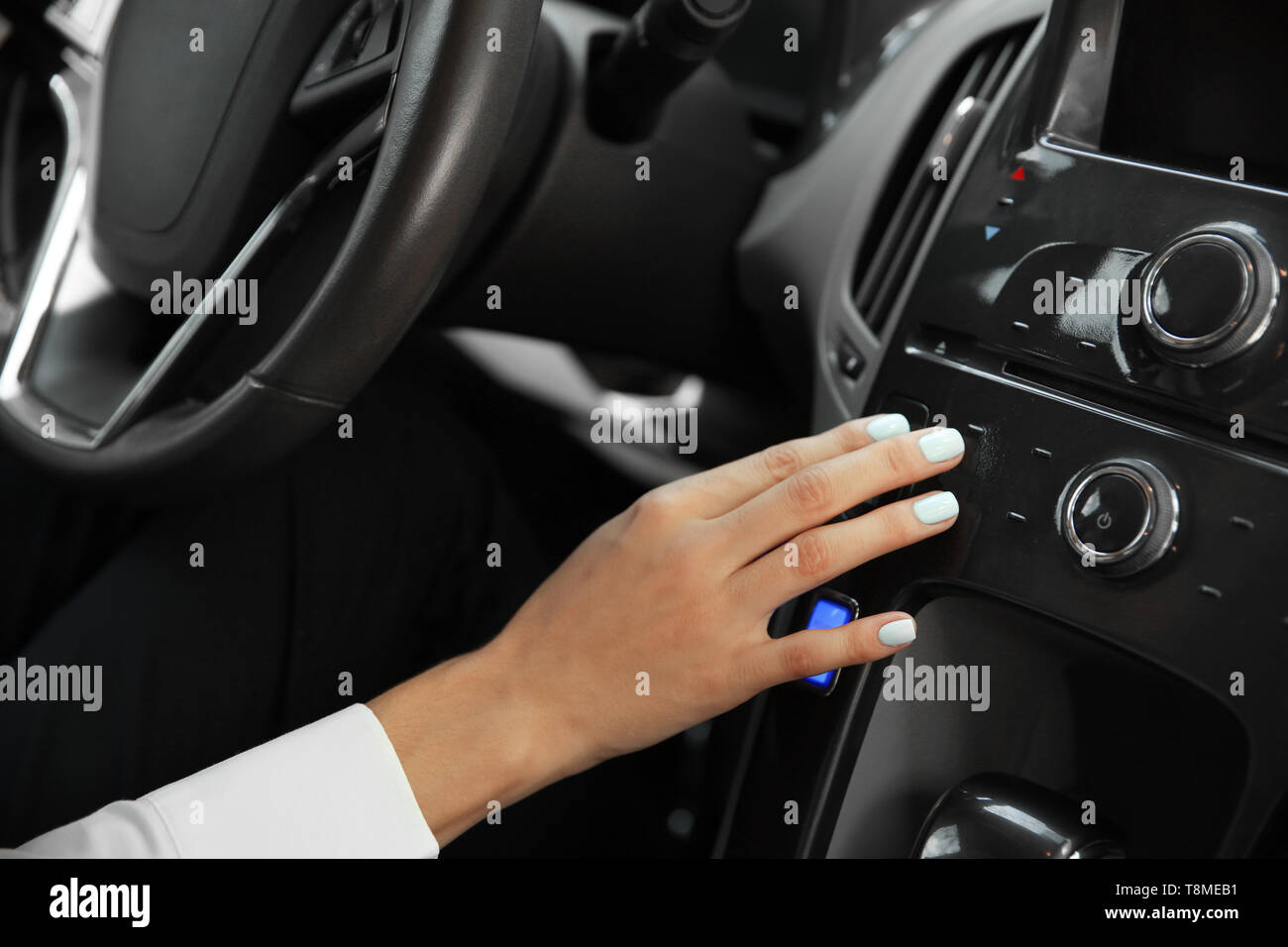 Woman tuning radio hi-res stock photography and images - Alamy