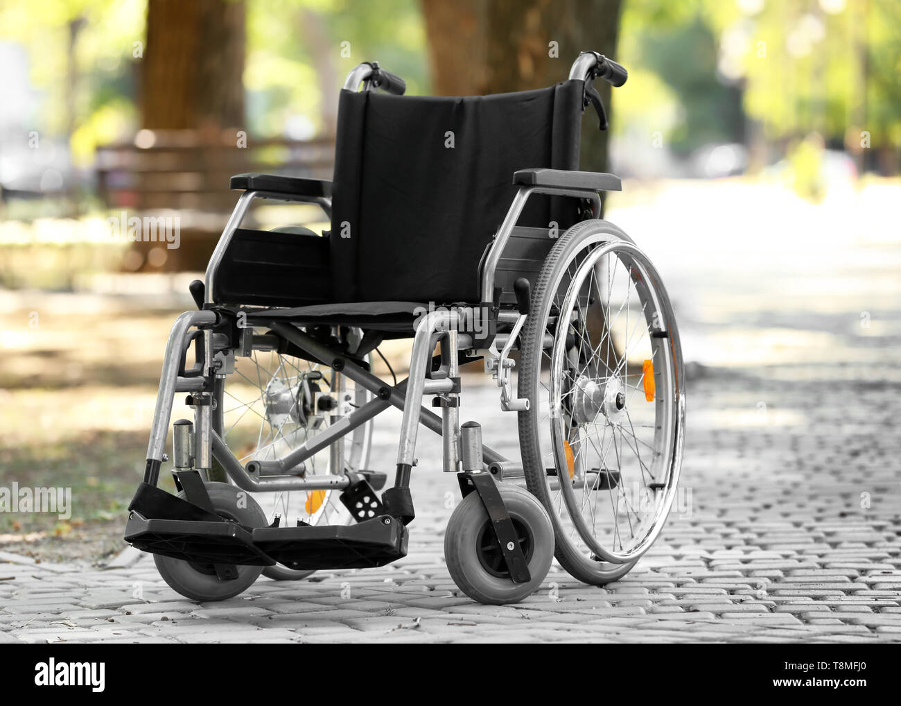 Empty modern wheelchair outdoors Stock Photo - Alamy