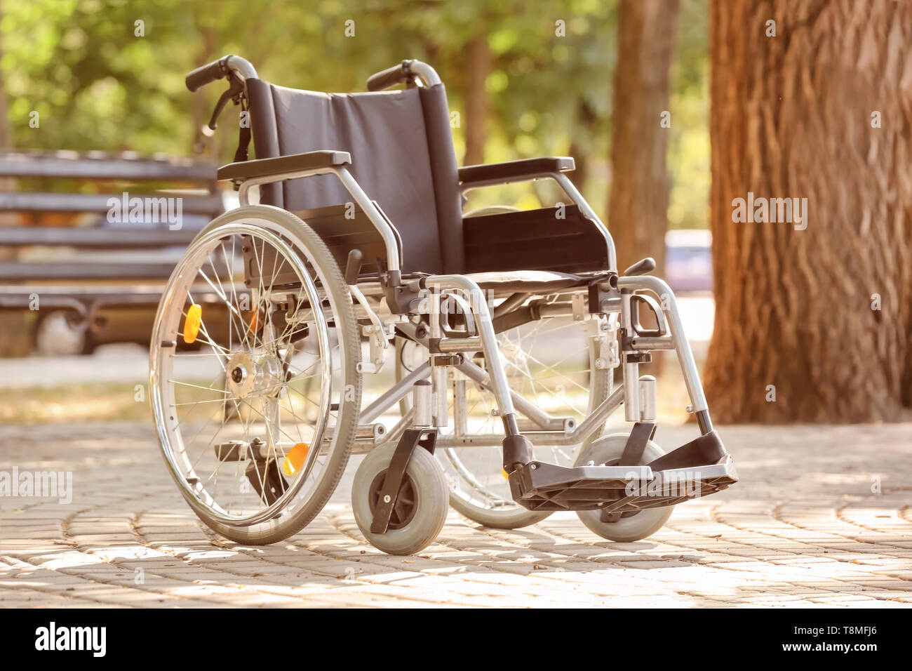 Empty modern wheelchair in park Stock Photo - Alamy