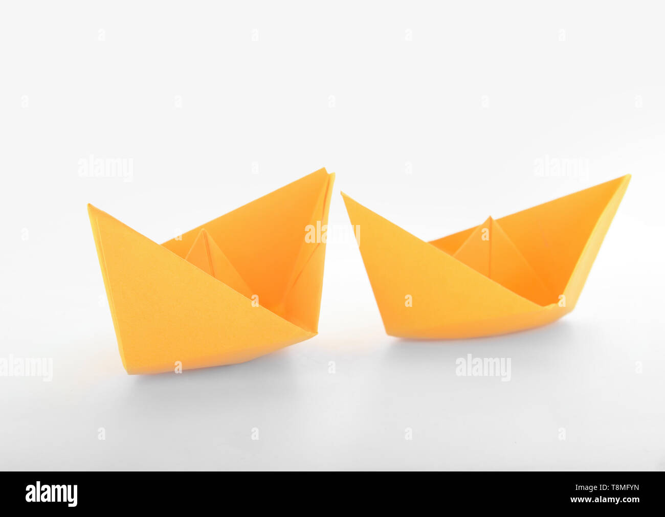 Origami boats on white background Stock Photo - Alamy