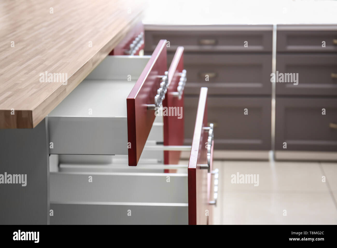 Open empty kitchen drawers Stock Photo - Alamy