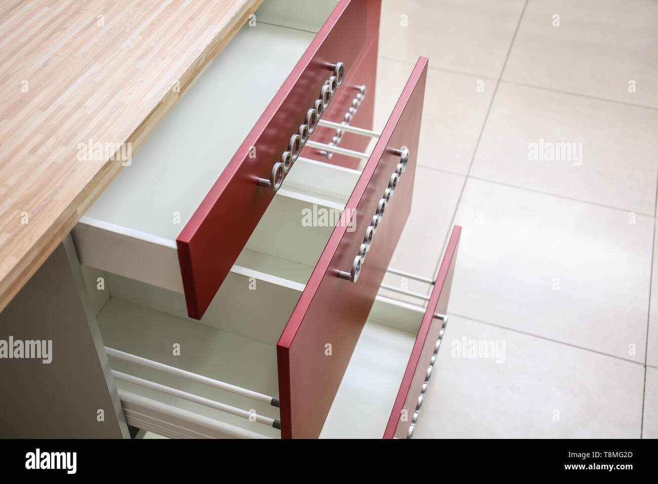 Open empty kitchen drawers Stock Photo - Alamy