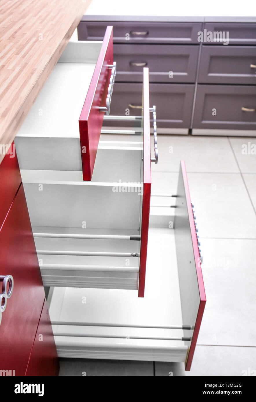 Open empty kitchen drawers Stock Photo - Alamy