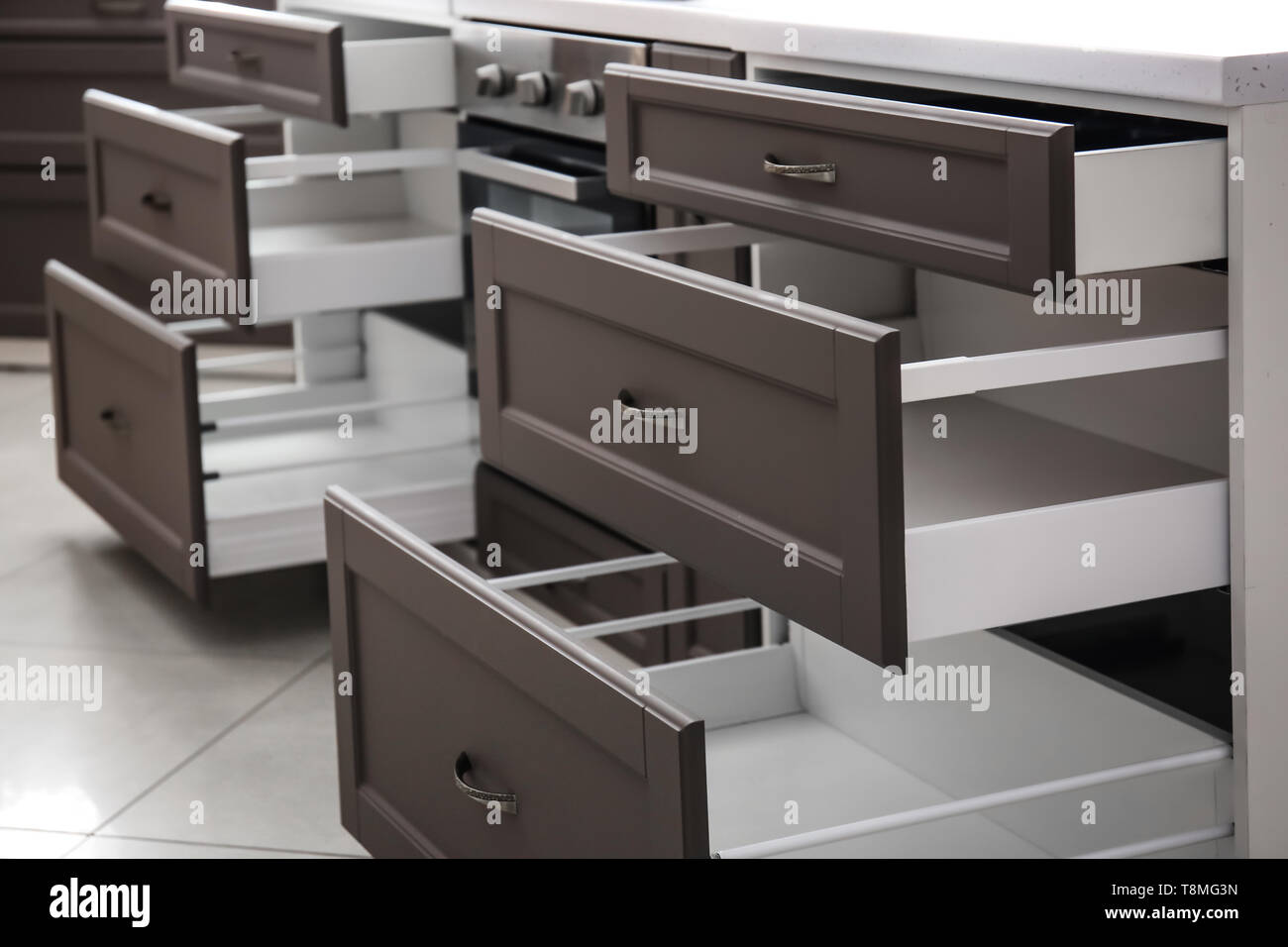 Open empty kitchen drawers Stock Photo - Alamy