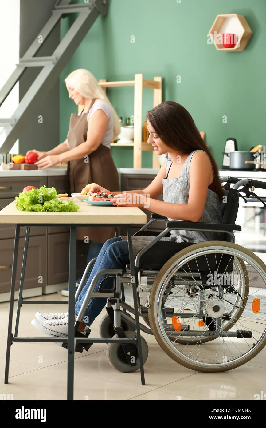 Handicapped woman eating hi-res stock photography and images - Alamy