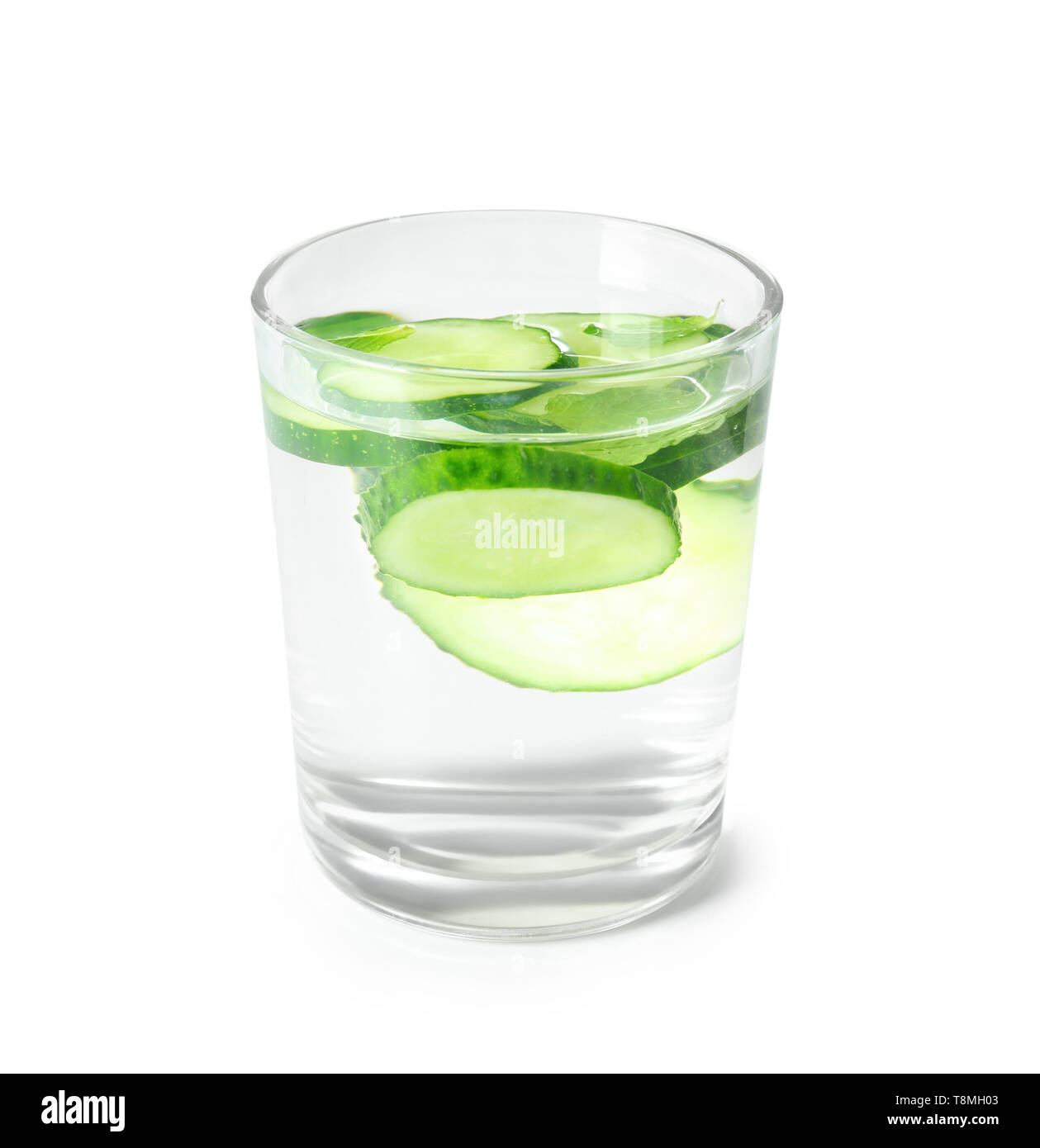 Glass of fresh cucumber water on white background Stock Photo - Alamy