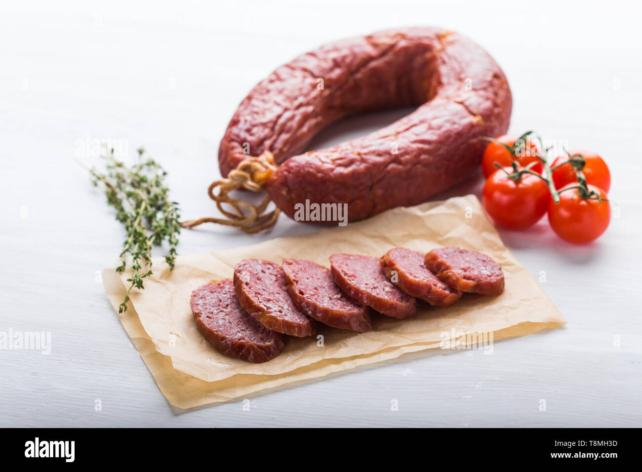 Food, meat and delicious concept - sausages made with horse meat with ...