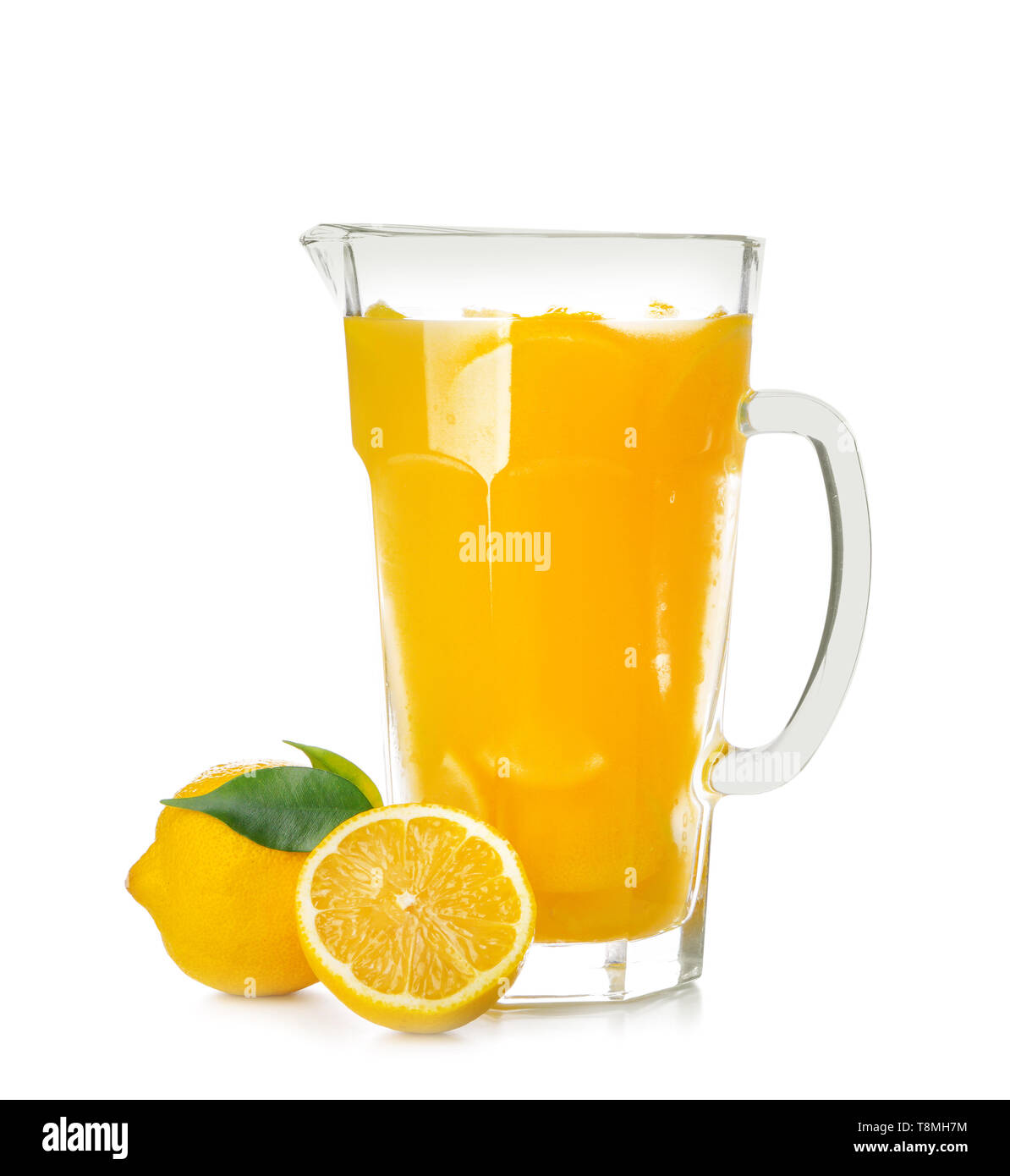 Jug of fresh lemon juice on white background Stock Photo - Alamy