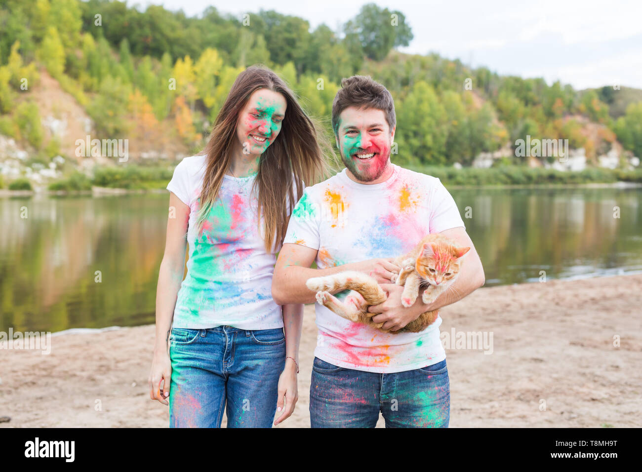 Festival holi, tourism and nature concept - Portrait of woman and man ...