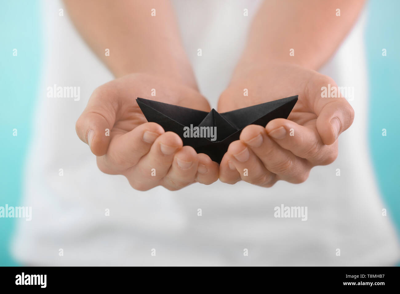 Hands holding paper boat hi-res stock photography and images - Alamy
