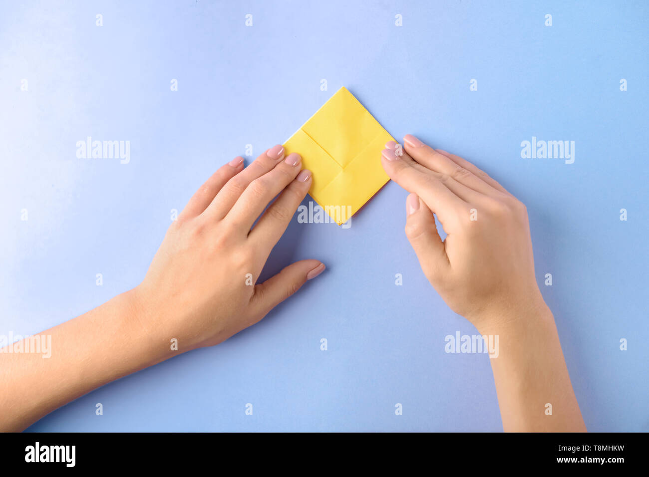 Hands making origami top view hi-res stock photography and images - Alamy