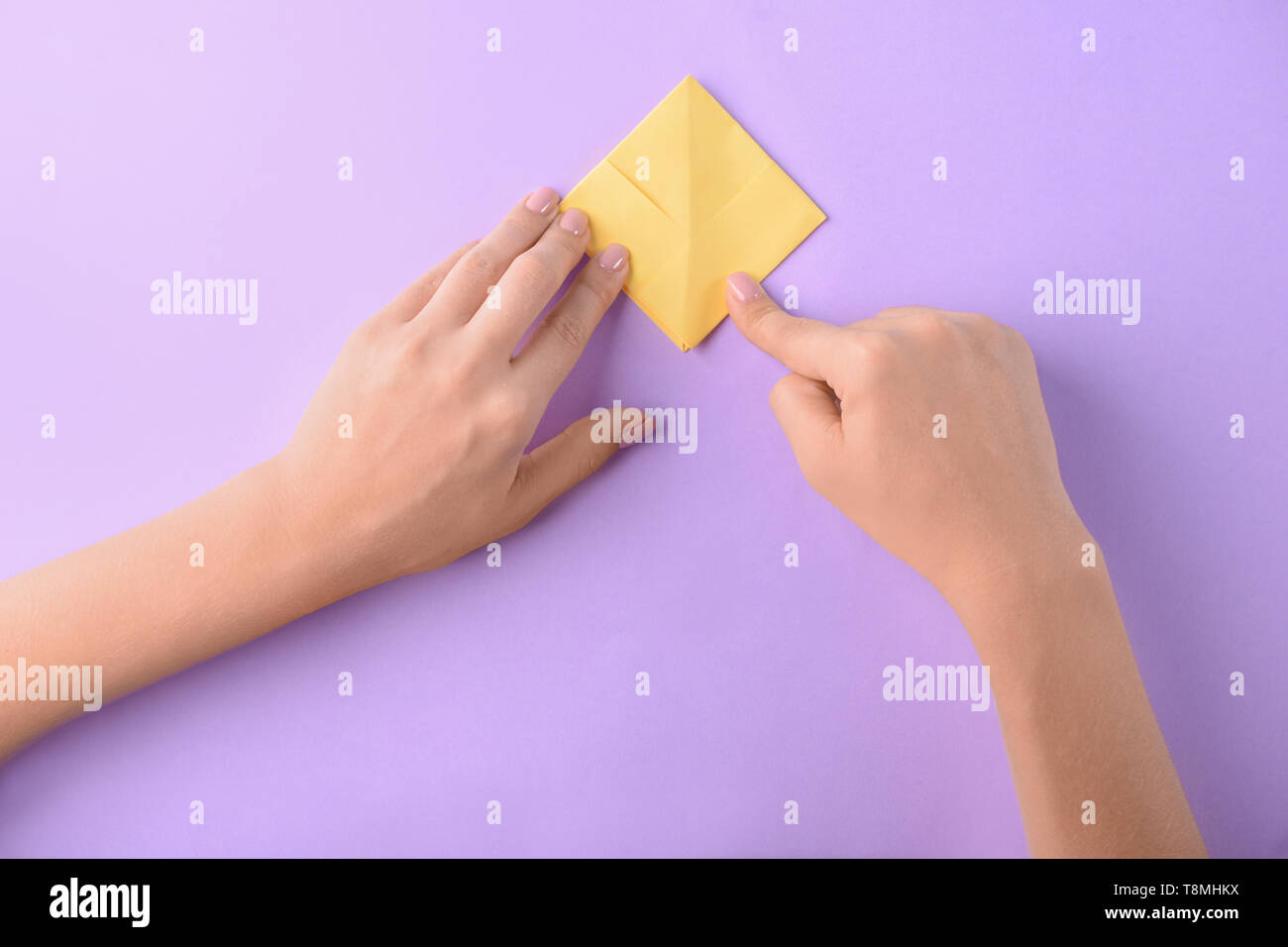 Hands making origami top view hi-res stock photography and images - Alamy