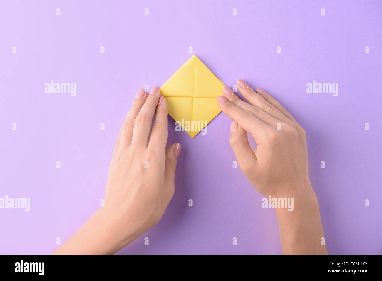 Hands making origami top view hi-res stock photography and images - Alamy