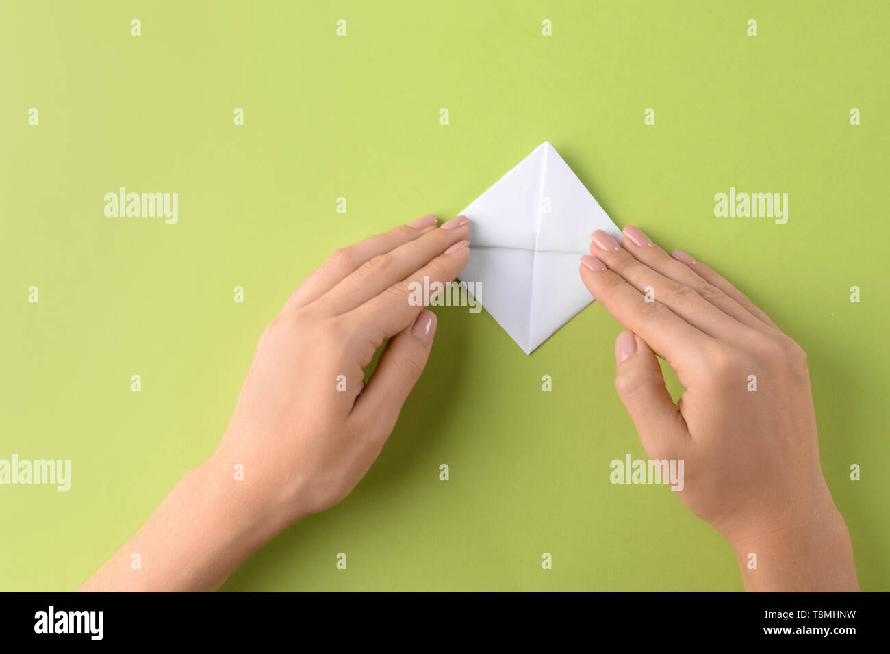 Hands making origami top view hi-res stock photography and images - Alamy