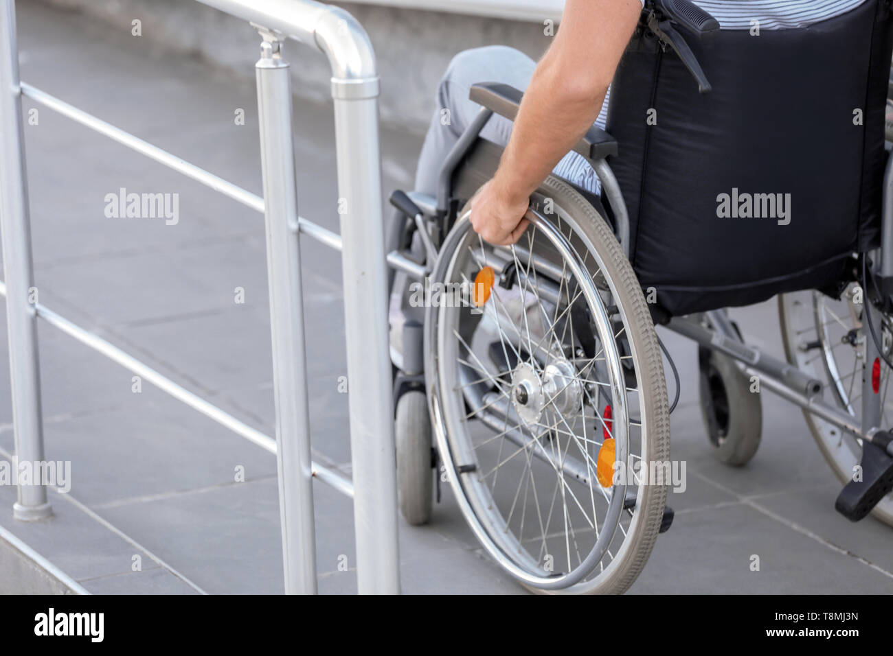 Young man wheelchair ramp hi-res stock photography and images - Alamy