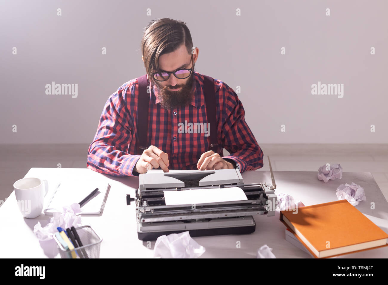people, writer and hipster concept - young stylish writer working on ...