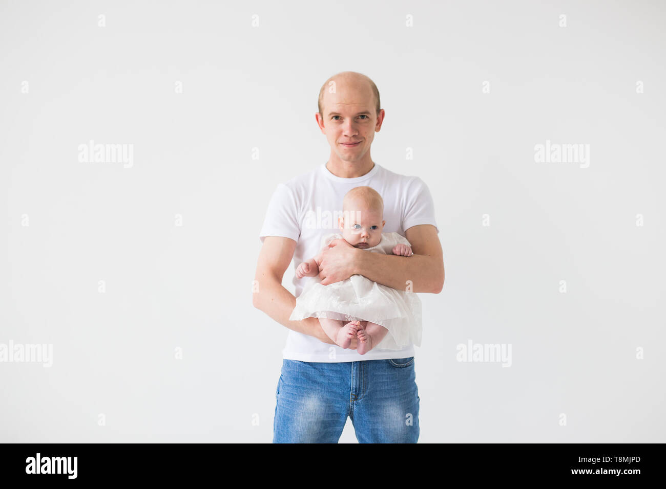 Children, family and fatherhood concept - happy bald father holding ...