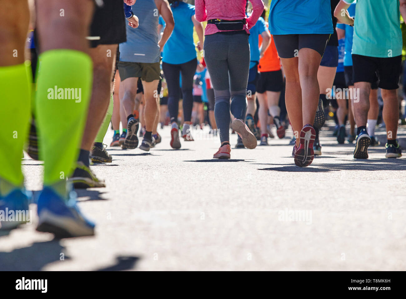 Marathon runners on the street. Healthy lifestyle. Athletes endurance ...