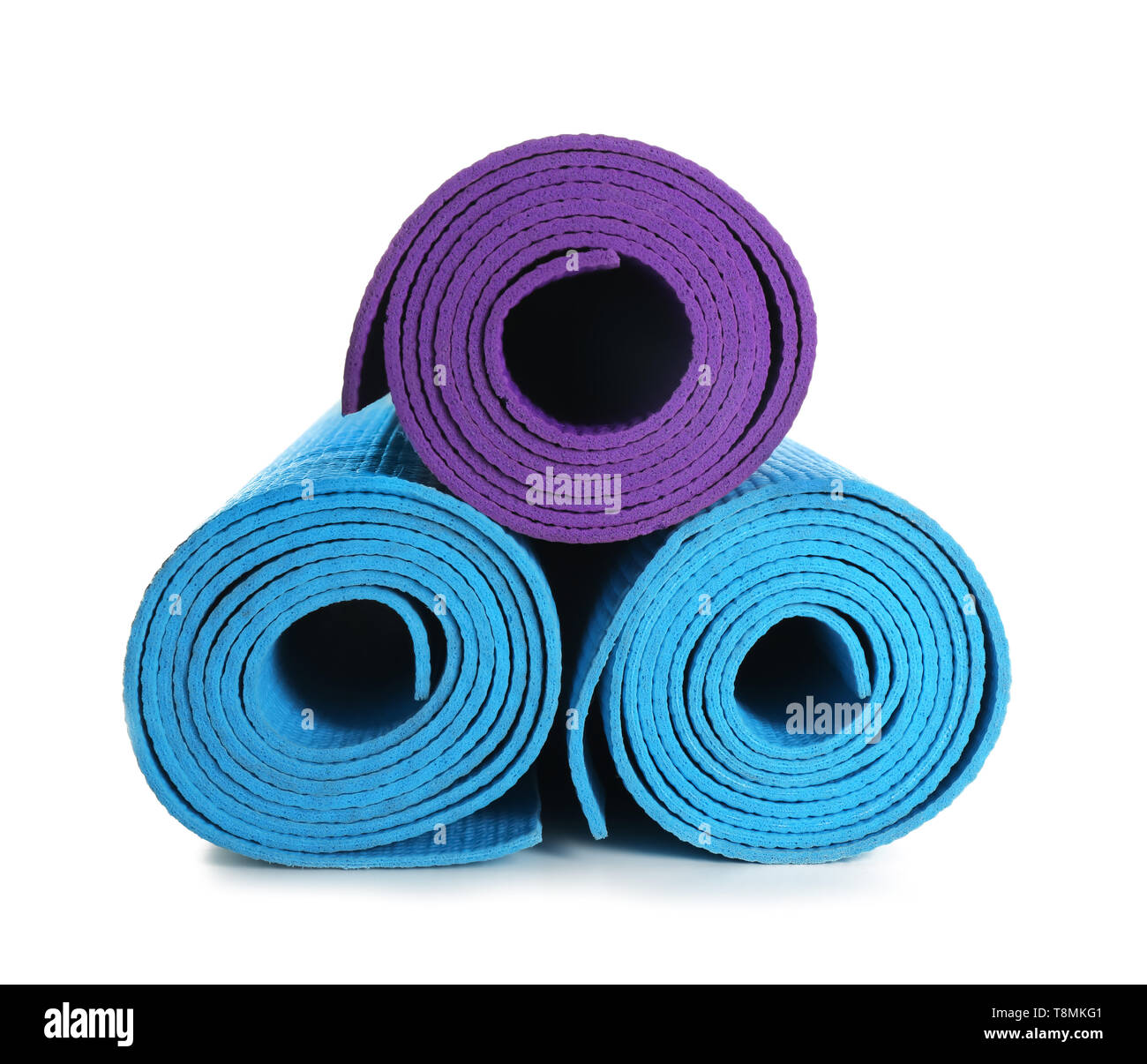 Different yoga mats on white background Stock Photo - Alamy