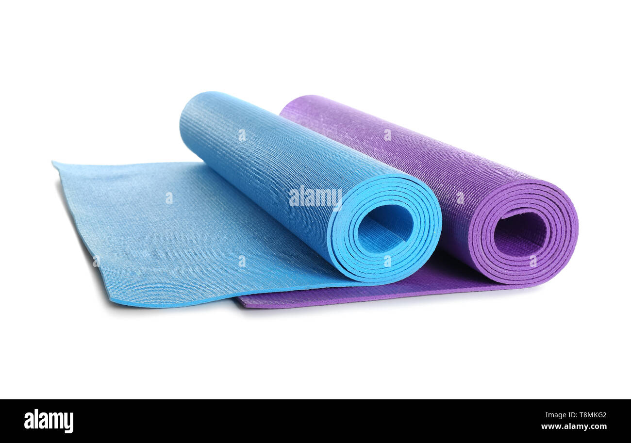 Different yoga mats on white background Stock Photo - Alamy