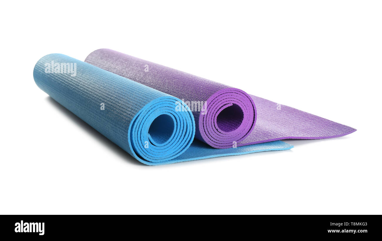 Different yoga mats on white background Stock Photo - Alamy