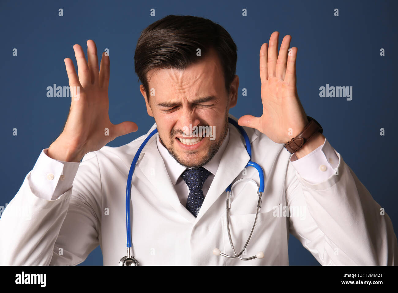 Stressed doctor hi-res stock photography and images - Alamy