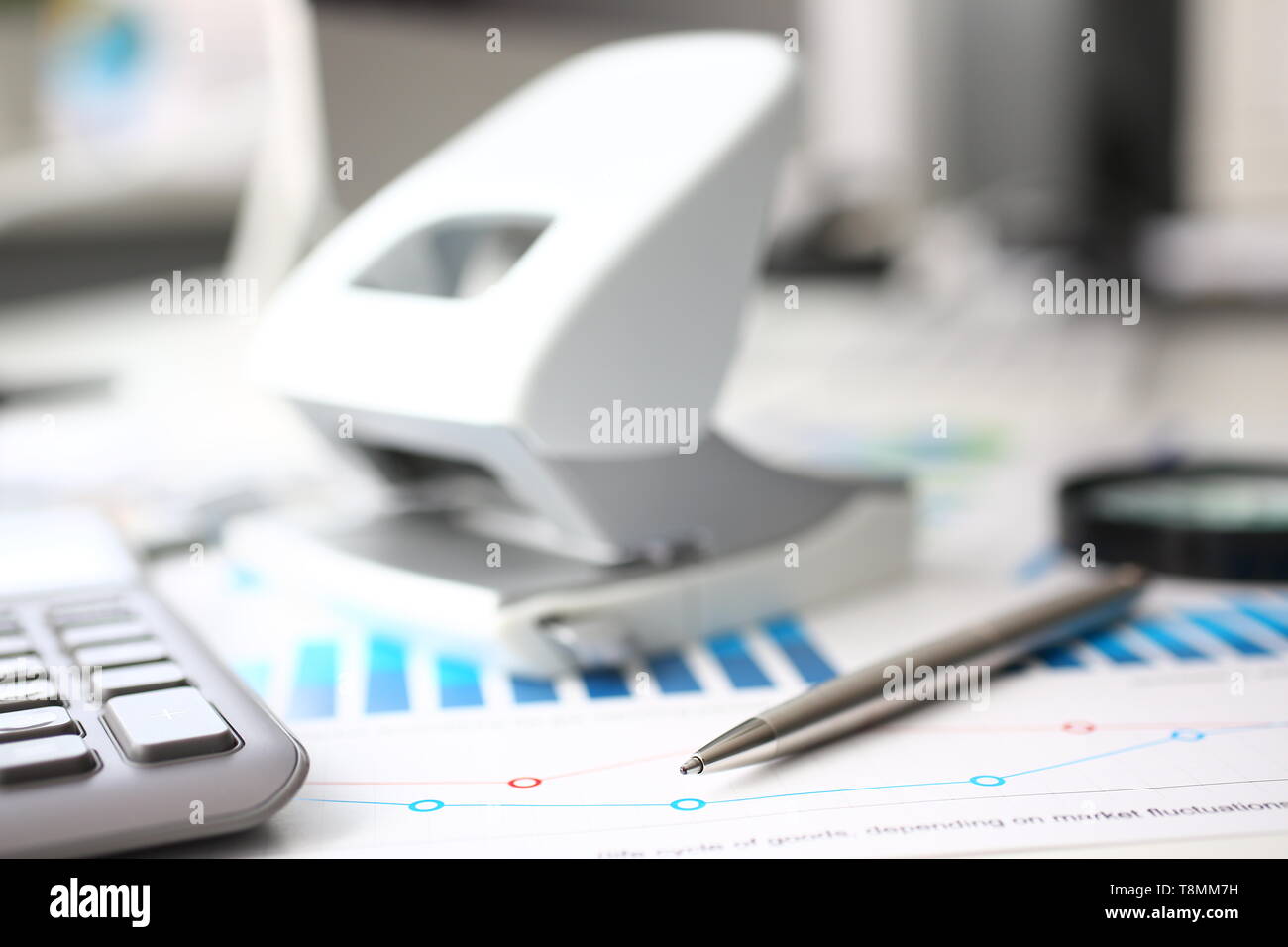 Silver calculator and financial statistics on clipboard Stock Photo - Alamy