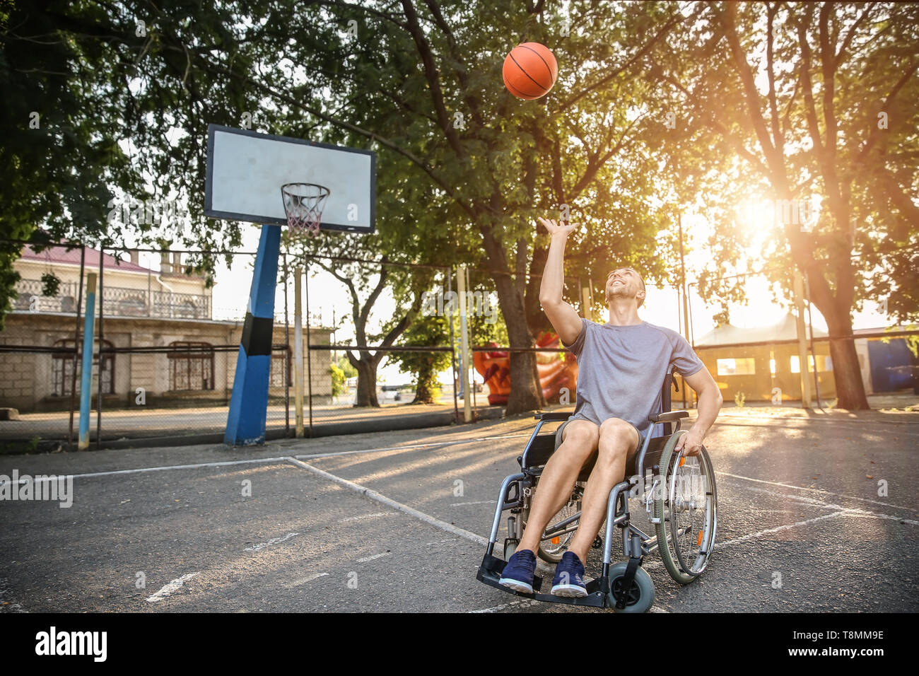 Disabled man in wheelchair throwing hi-res stock photography and images ...