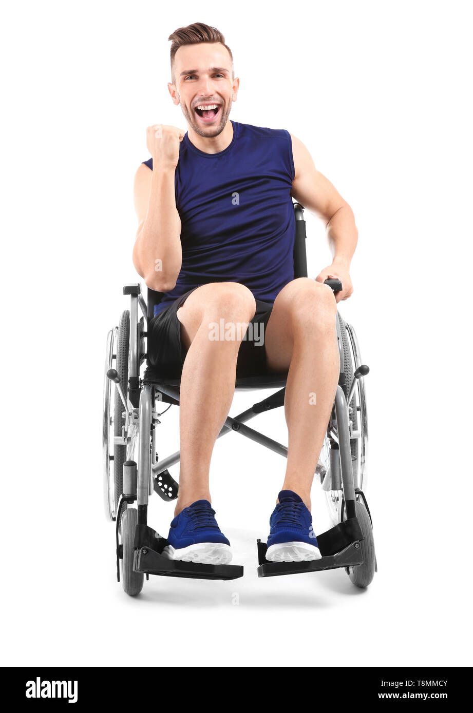 Happy sporty man sitting in wheelchair on white background Stock Photo ...