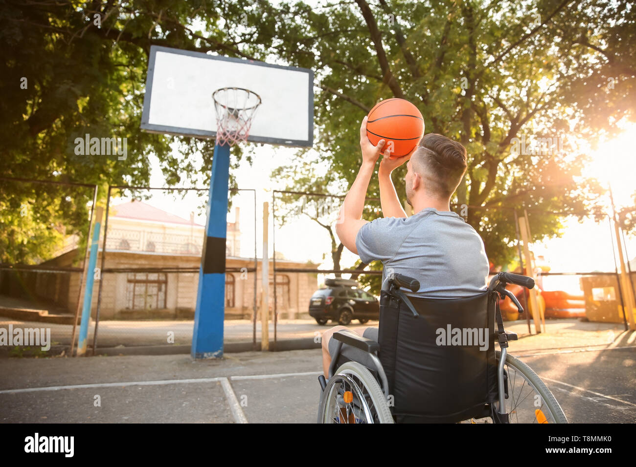 Disabled man in wheelchair throwing hi-res stock photography and images ...