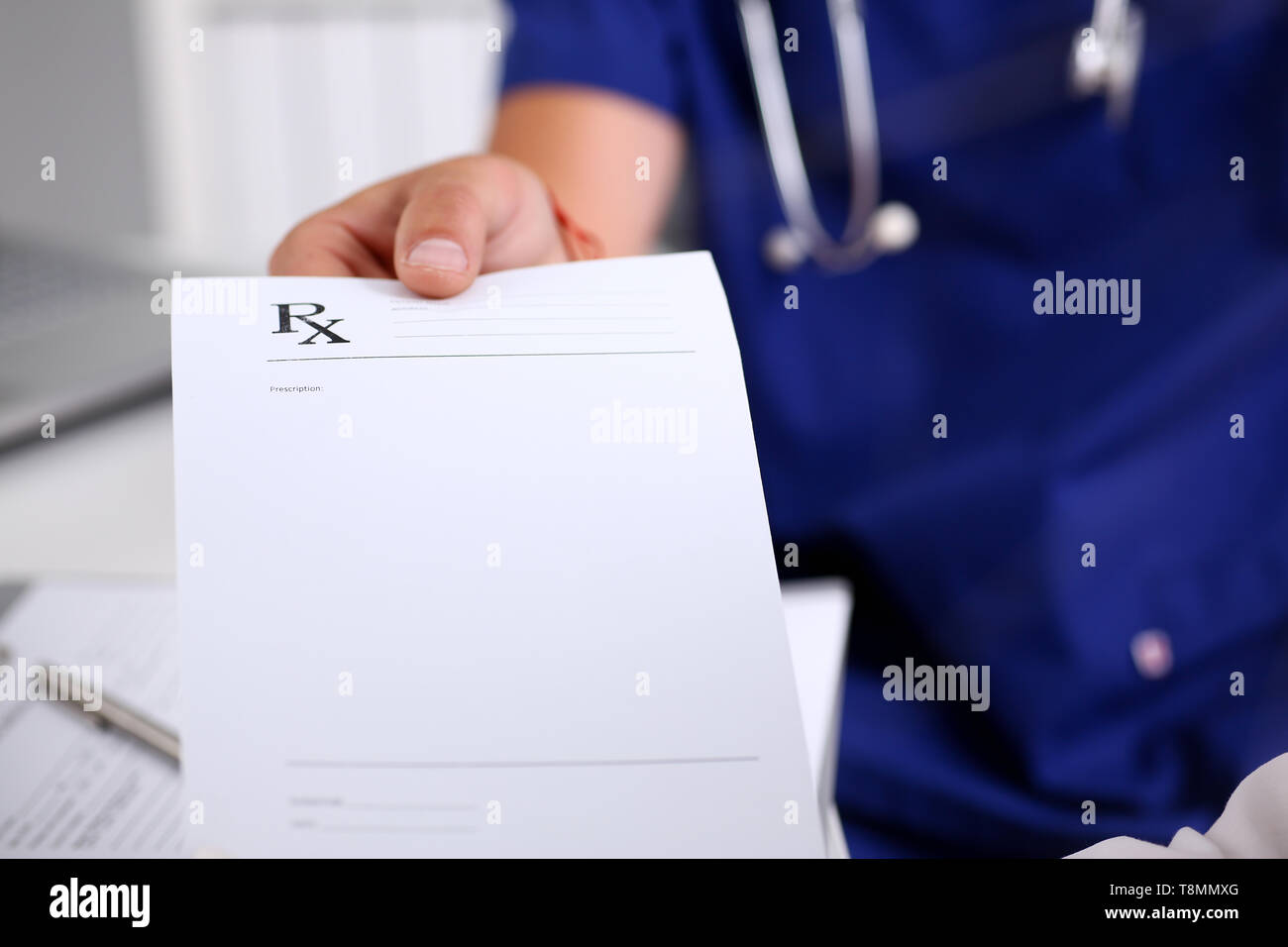 Male medicine doctor hand give prescription to patient Stock Photo - Alamy