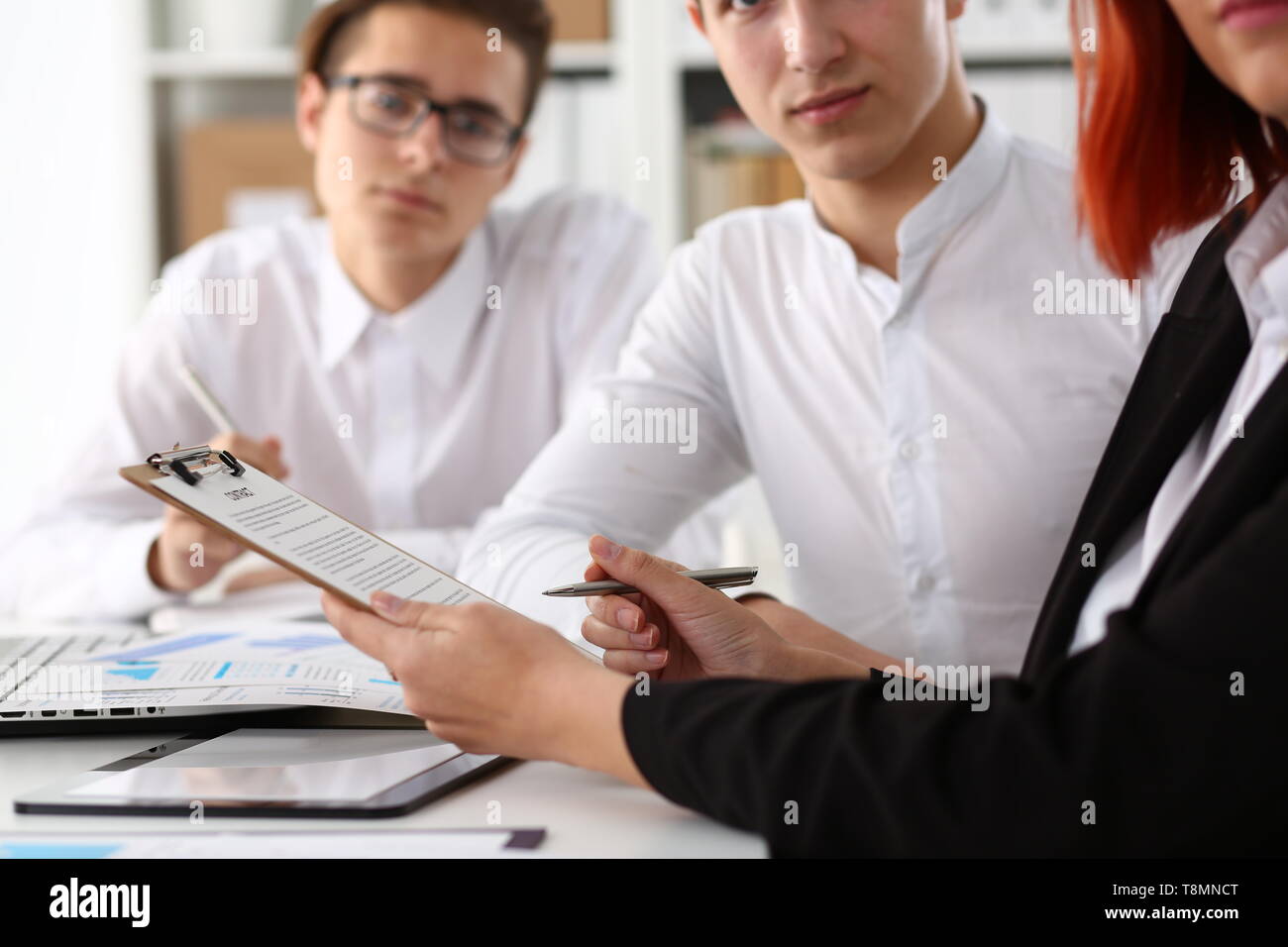 Group people sit in office deliberate on problem Stock Photo - Alamy