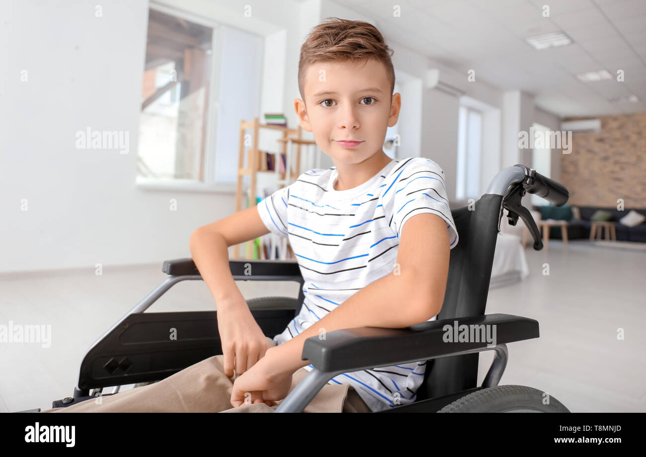 Handicapped boy in wheelchair at home Stock Photo - Alamy