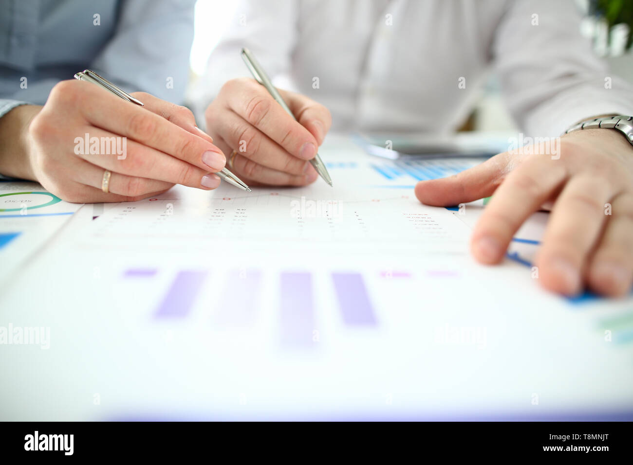 Business people discussing stock chart hi-res stock photography and ...