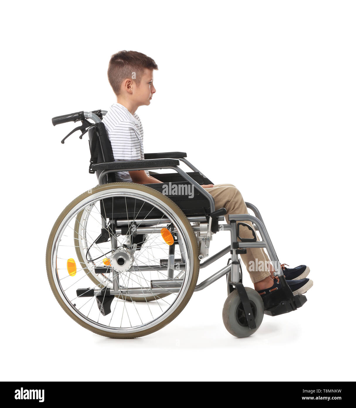 Boy in wheelchair on white background Stock Photo - Alamy